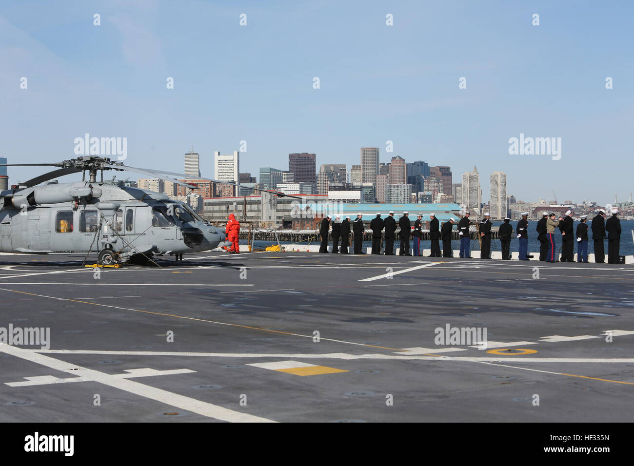 Marines and sailors aboard the USS Arlington ‘man the rails’ as the ...