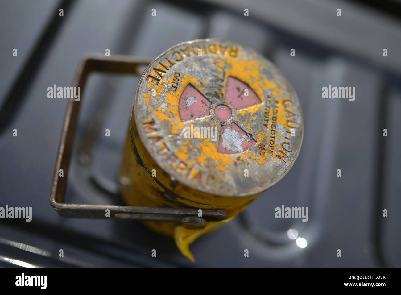 A small container filled with radioactive material sits on the back of ...