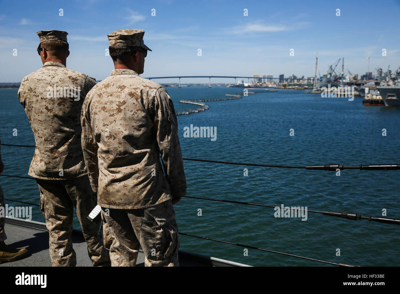 U.S. Marines with the 15th Marine Expeditionary Unit watch as the USS ...