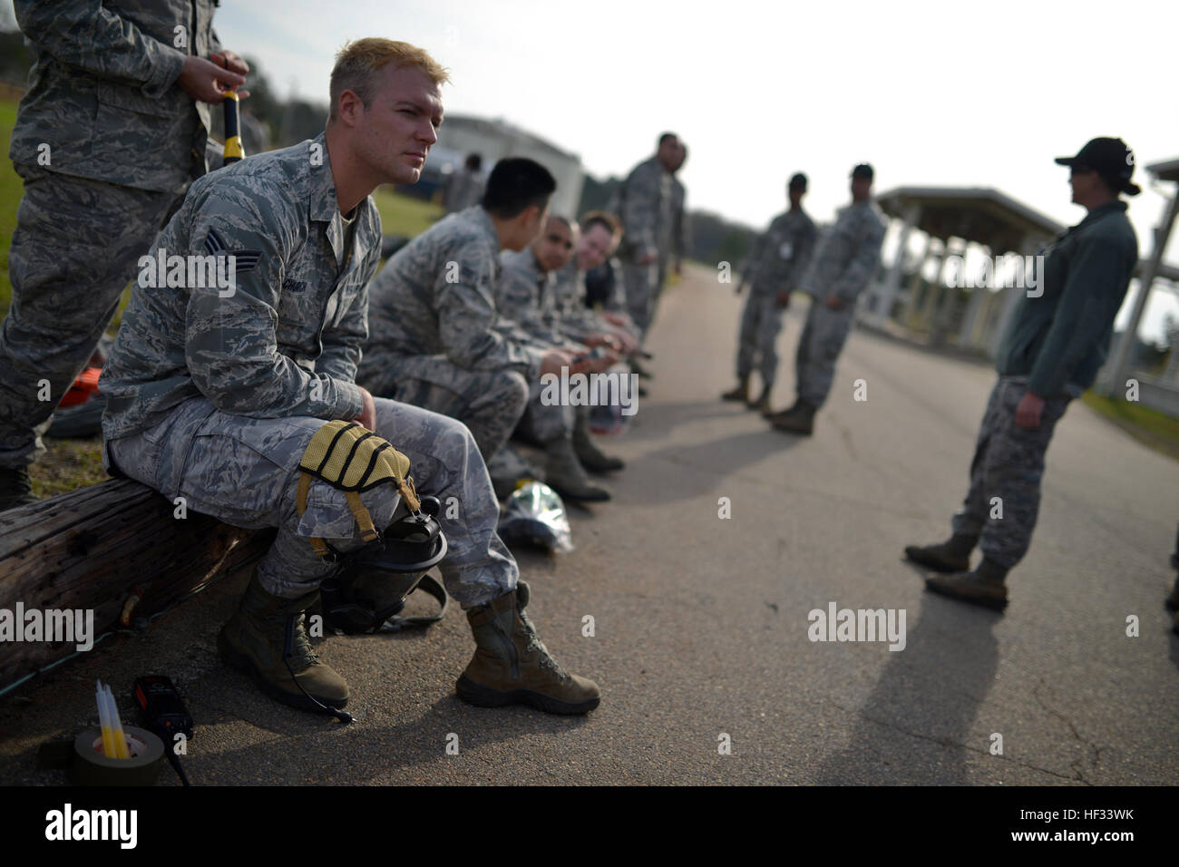 Senior Airman Ken Church waits to put on his Level A suit during a ...