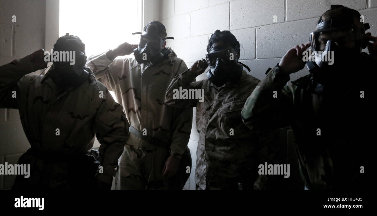 U.S. Marines with the 26th Marine Expeditionary Unit break the seal of ...