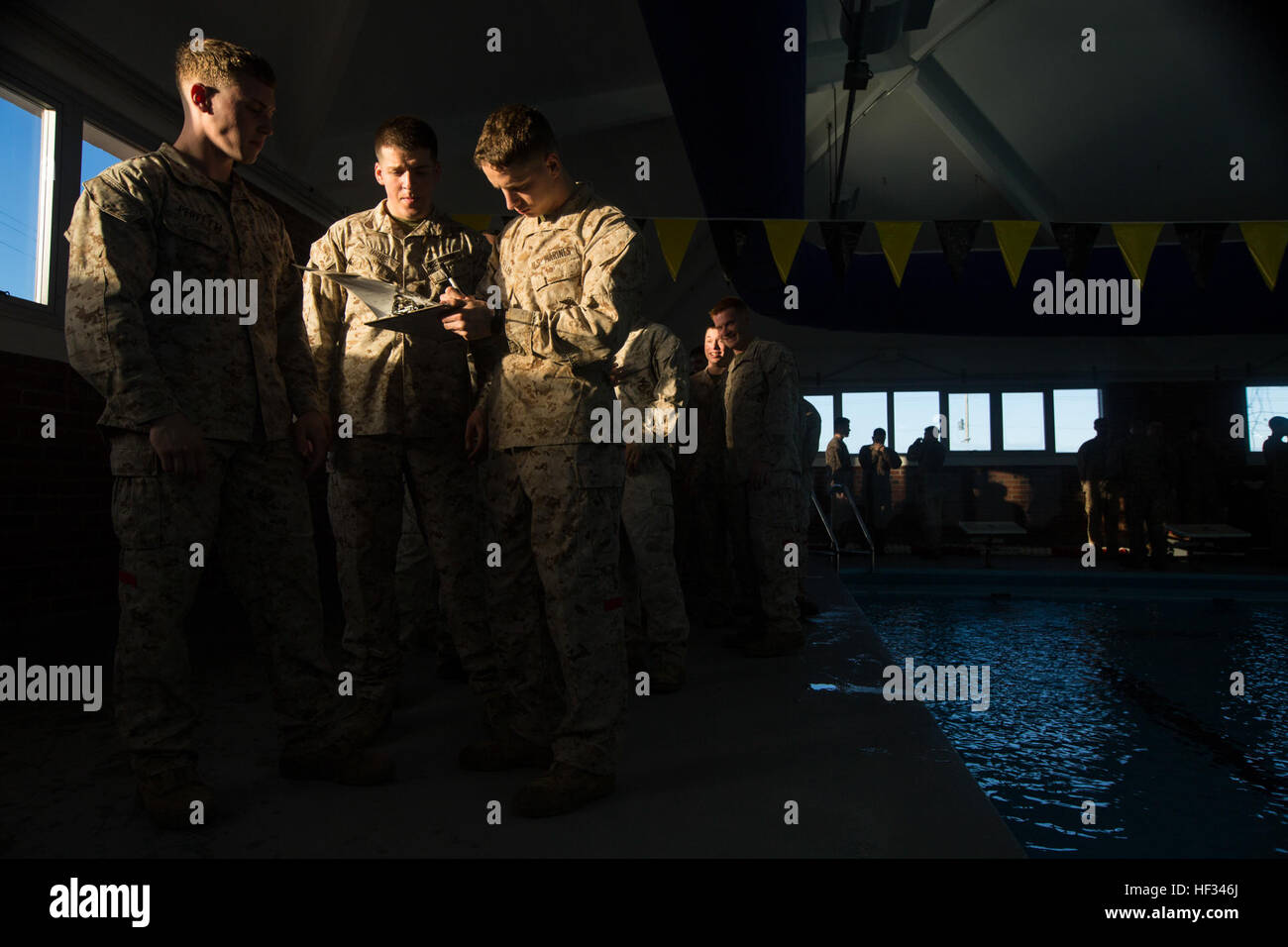 U.S. Marines with Combat Logistics Battalion 2, sign their names in an ...