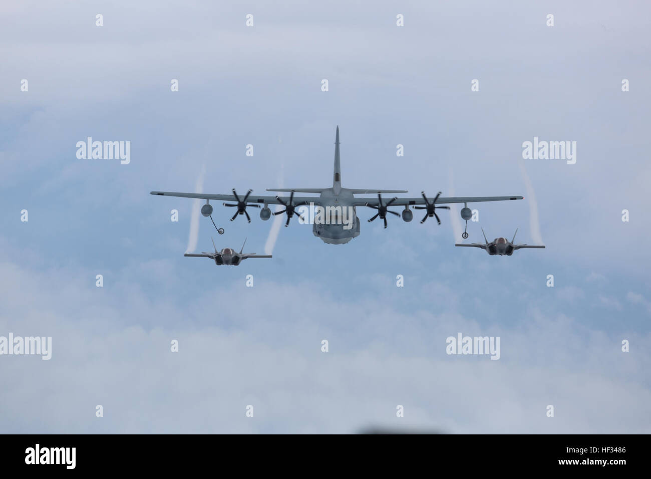A U.S. Marine Corps KC-130 flies with two F-35B Lightning II Joint ...