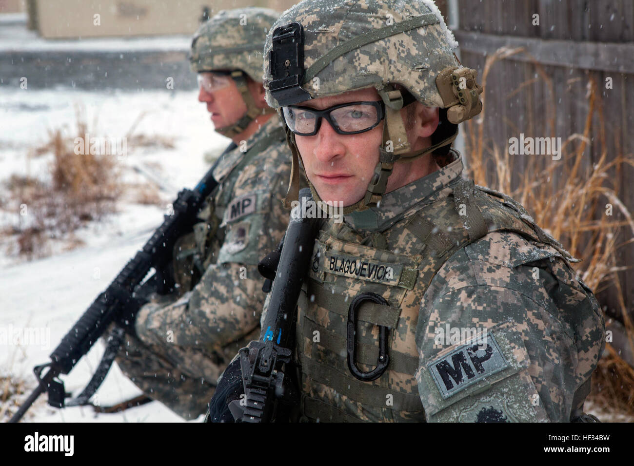 Sgt. 1st Class John K. Blagojevich, front, and Capt. Matthew R. Neamand ...