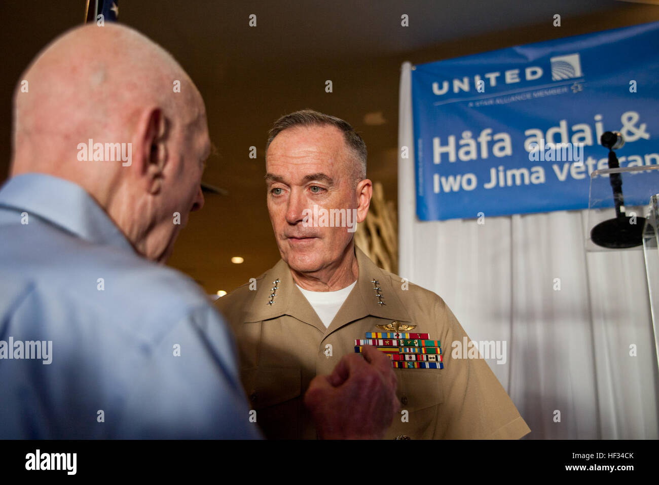 Commandant of the Marine Corps Gen. Joseph F. Dunford Jr. listens to a ...