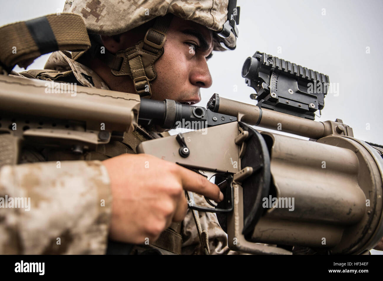 U.S. Marine Daniel Del Rio aims in with his M32 semi-automatic grenade ...