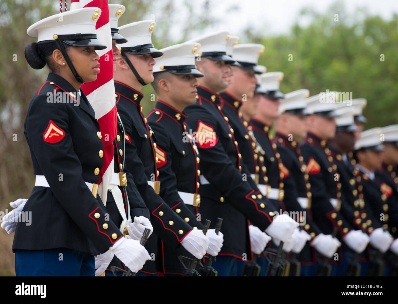 U.S. Marine Corps III Marine Expeditionary Force color guard stands at ...