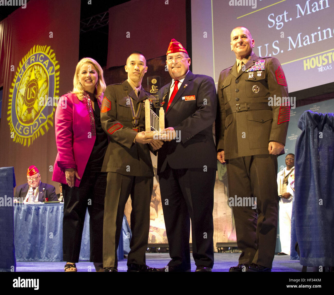 Sergeant Man Chan accepts the American Legion's Spirit of Service Award ...
