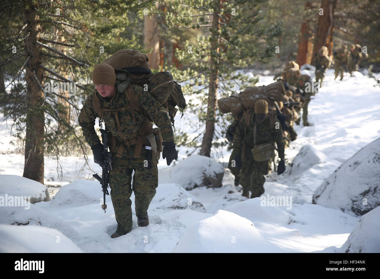 Marines and sailors with 1st Battalion, 3rd Marine Regiment hike ...