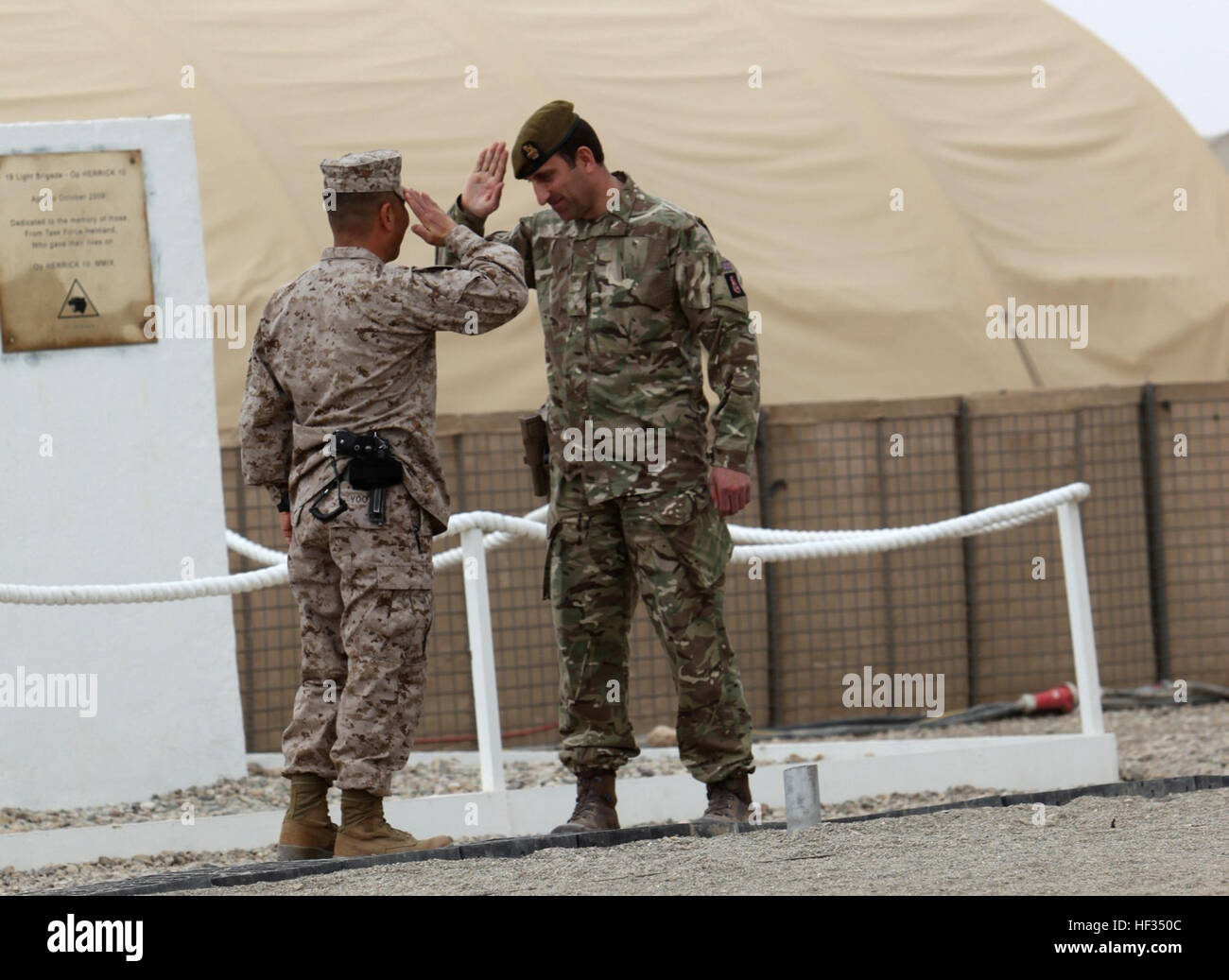 Brigadier James Woodham, right, commander of Task Force Helmand, gives ...