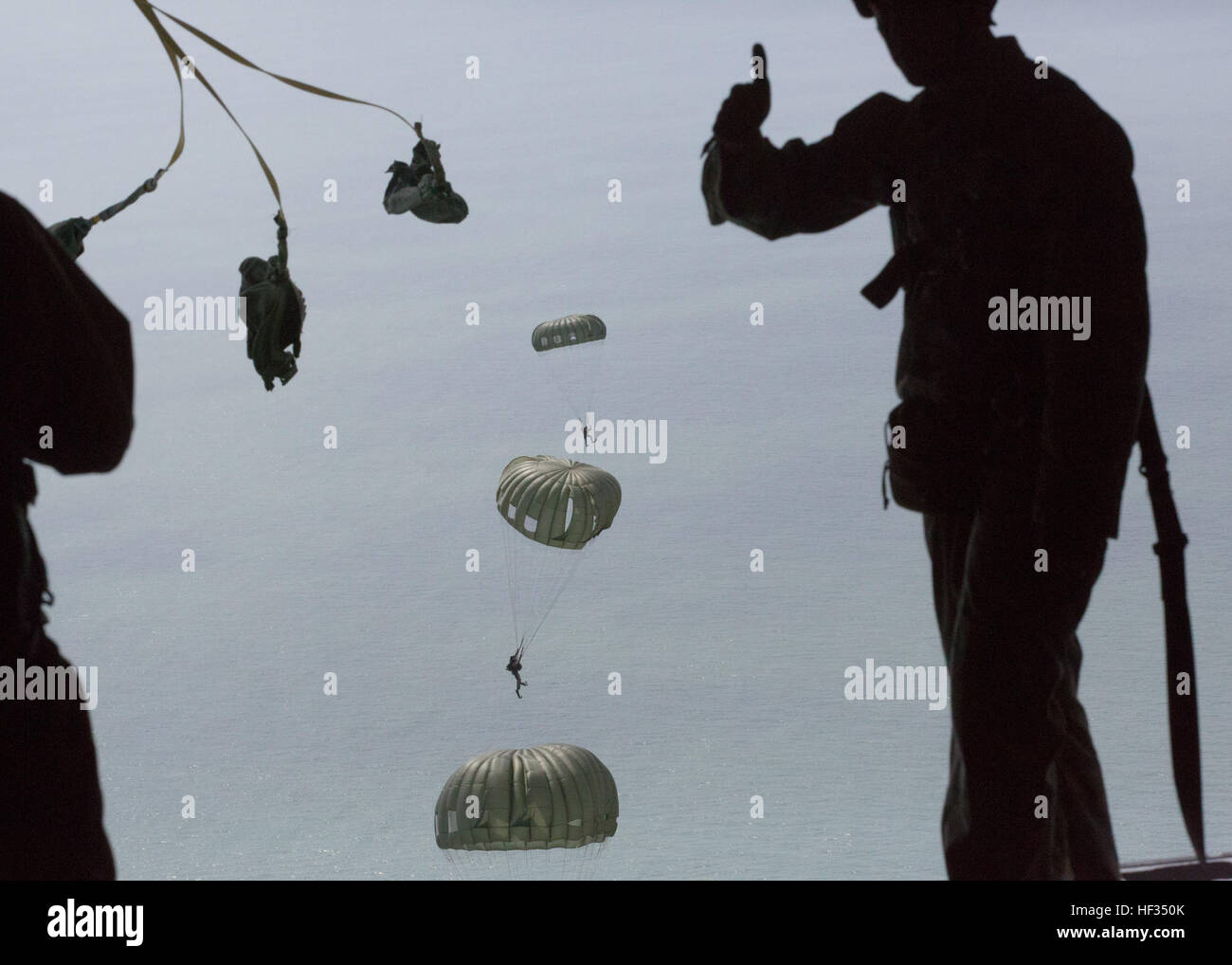 The jumpmaster gives the thumbs-up signal after four Marines from 2nd ...