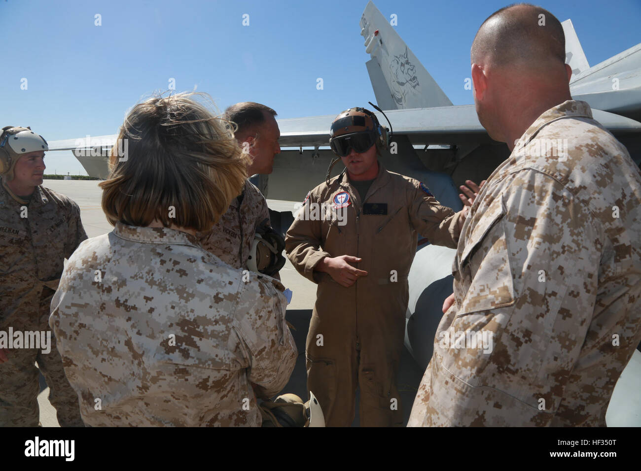 An F-18 mechanic from Marine Fighter Attack Squadron 122 briefs ...