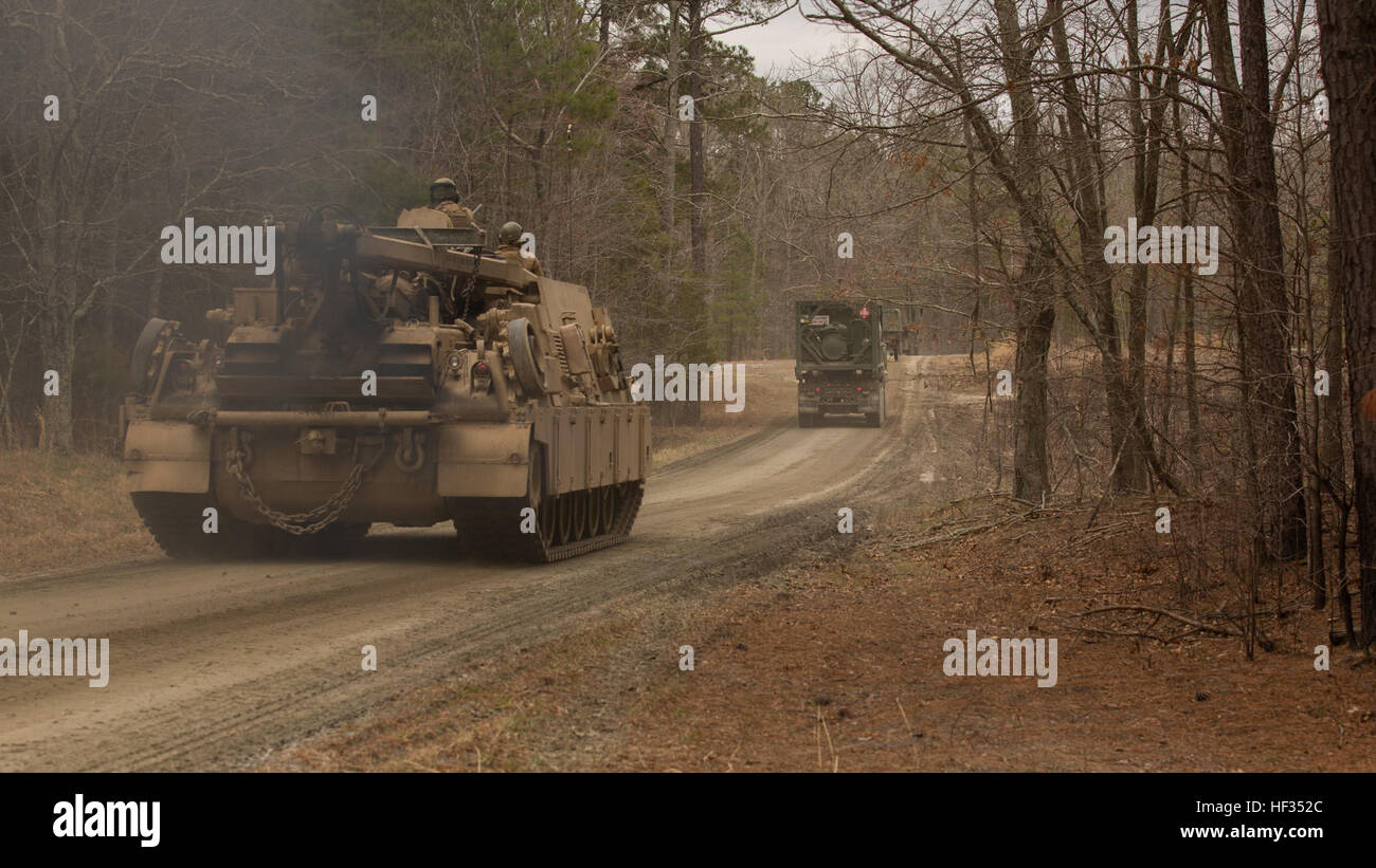 Marines with 2nd Tank Battalion, 2nd Marine Division, drive an M88 ...