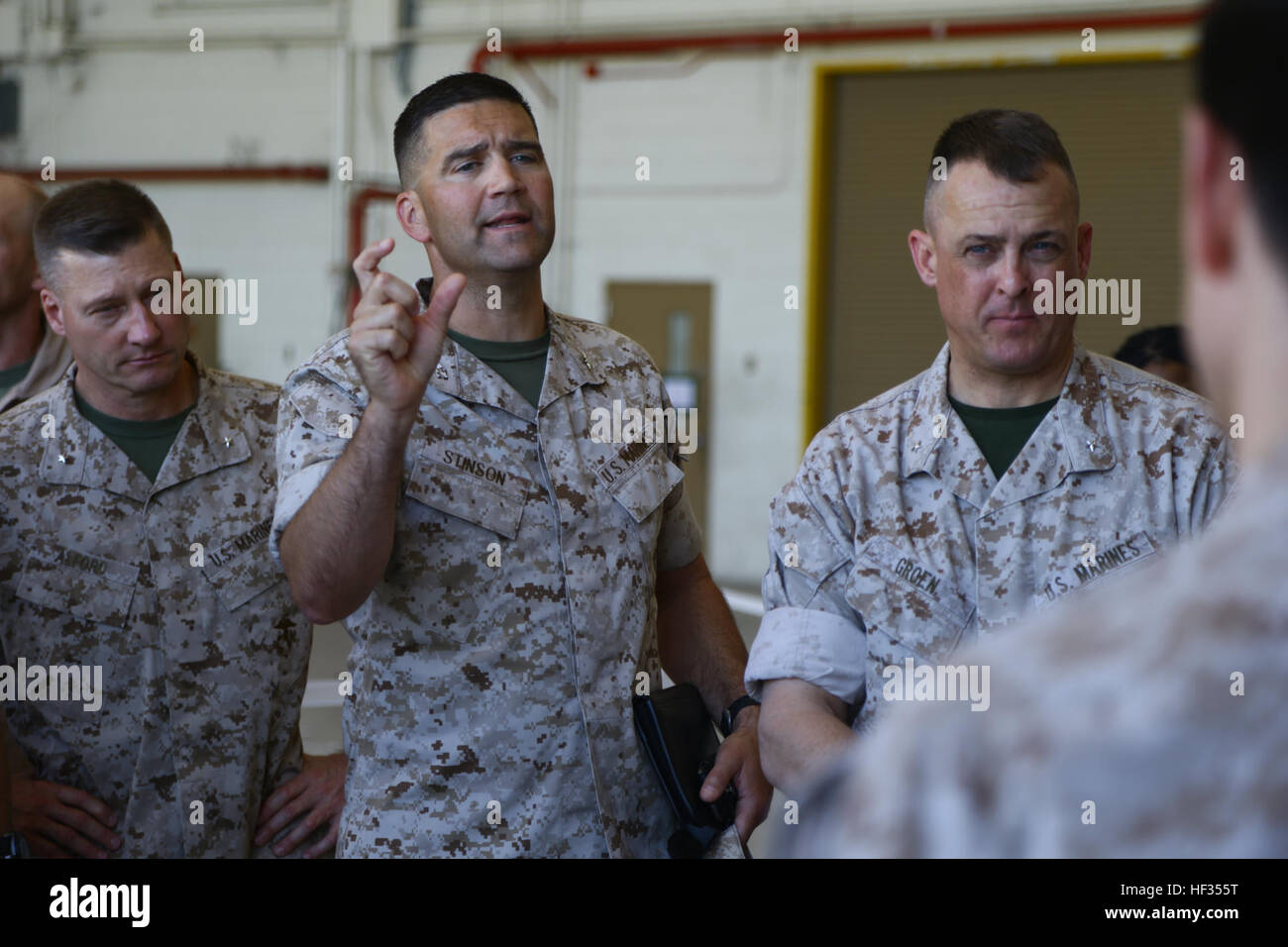 U.S. Marine Col. Benjamin Stinson, center, Commanding Officer for ...