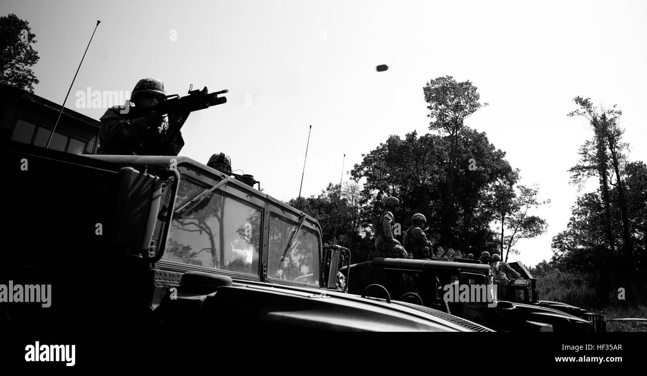 Military Policeman Spc. Michael Conley, 81st Troop Command, fires a 44 ...