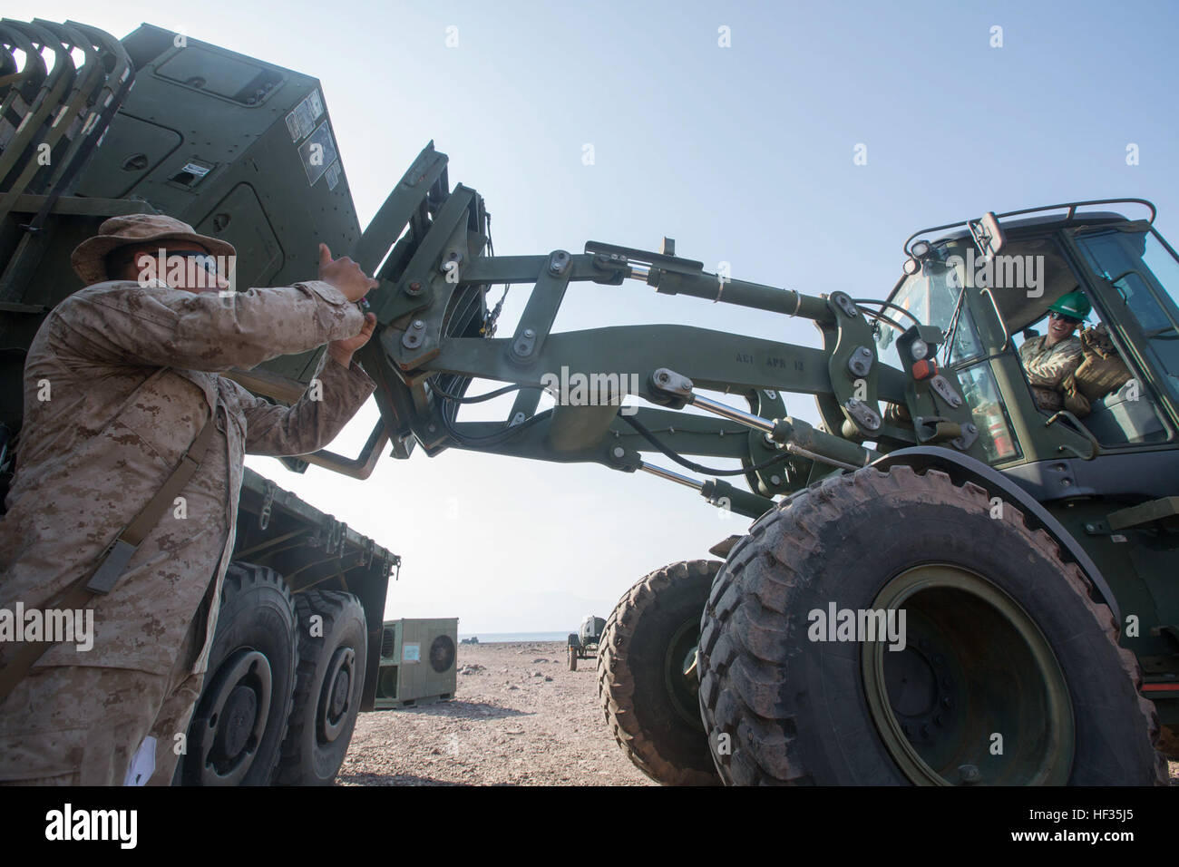 Staff Sgt. Michael Espinoza, left, a landing support specialist, and ...