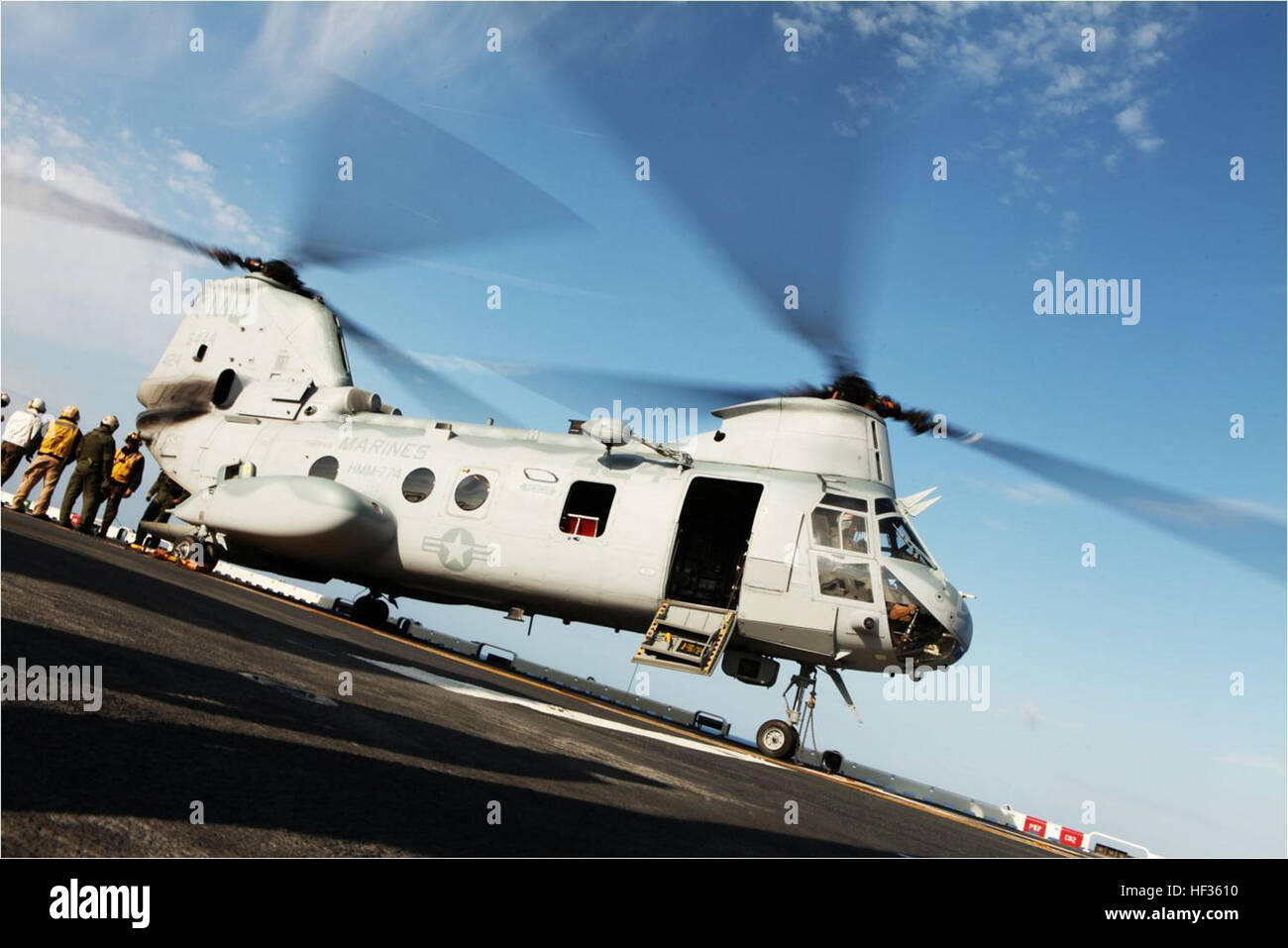 Marines and Sailors aboard the USS Wasp prepare for the arrival of the ...