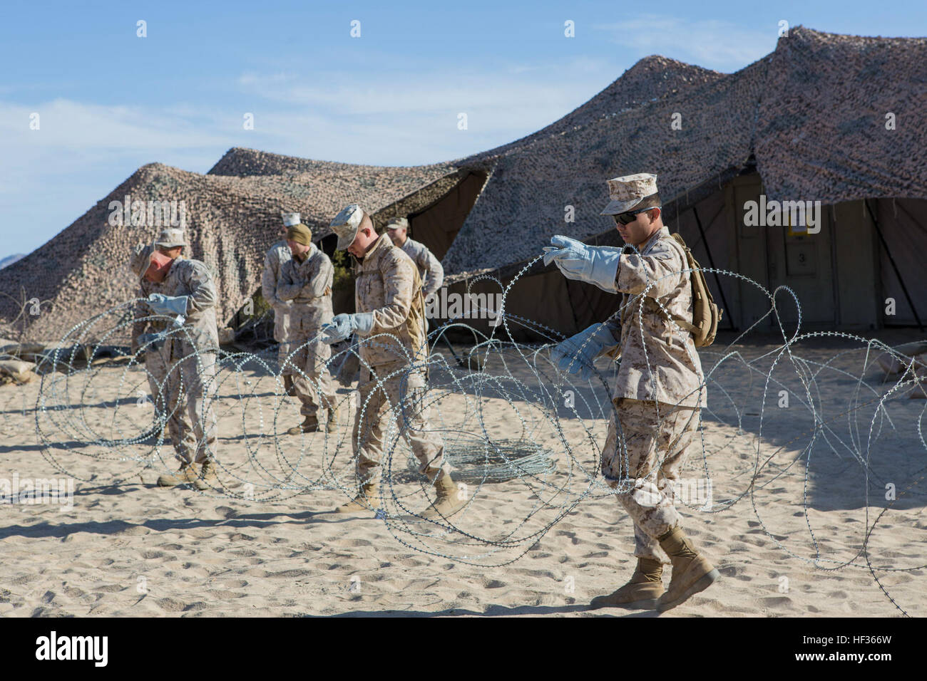 Marines with Combat Logistics Regiment-1 set concertina wire to aid in ...