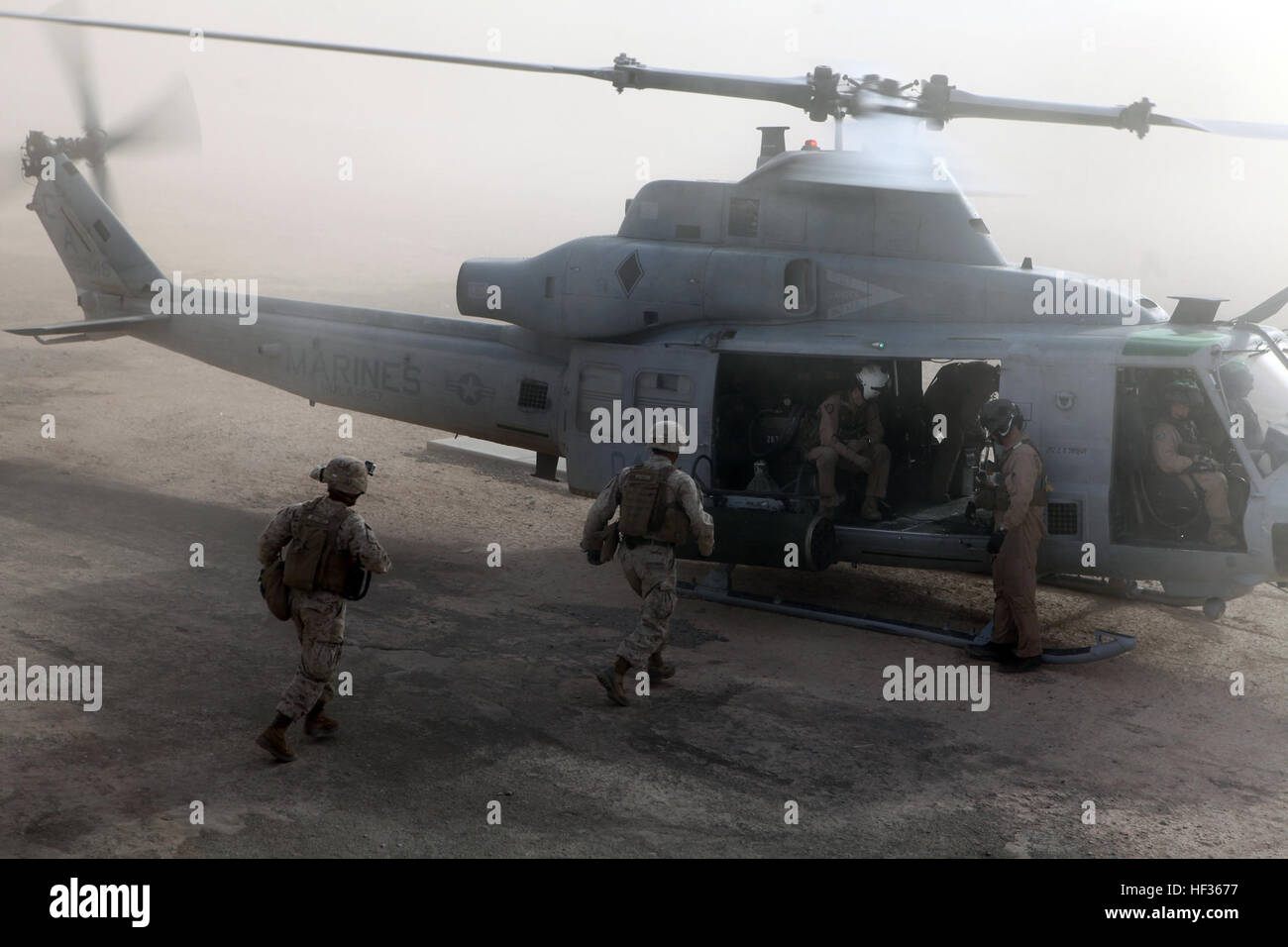 Marines board a UH-1Y Venom helicopter during a fast rope training ...