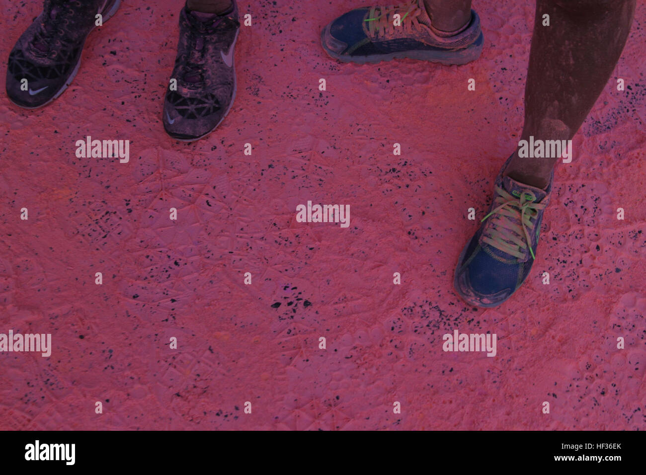 Participants stand in the remaining color powder used during the Color ...