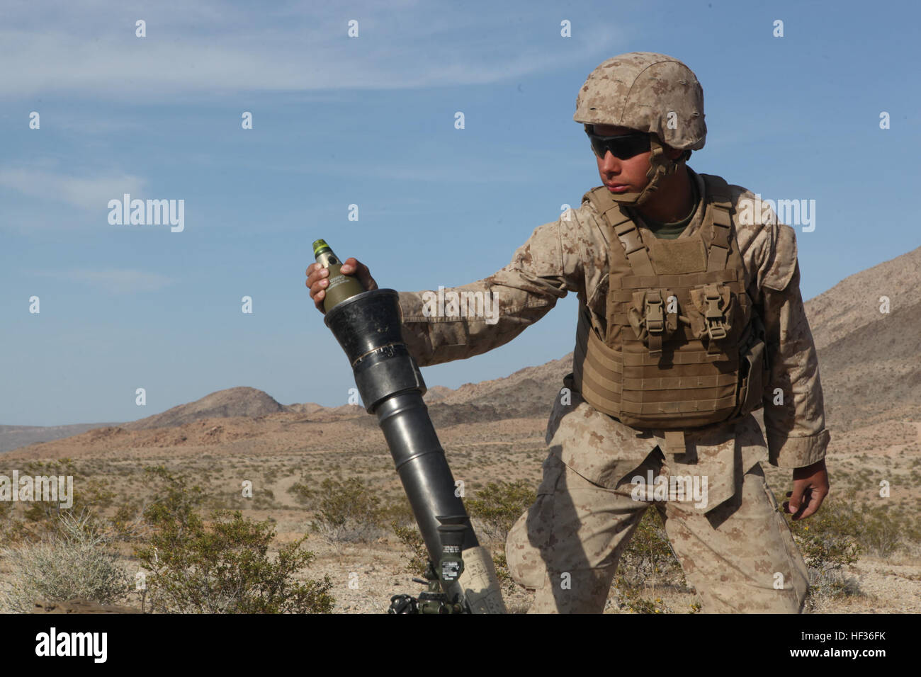 A mortarman from Weapons Company, 3rd Battalion, 5th Marine Regiment ...