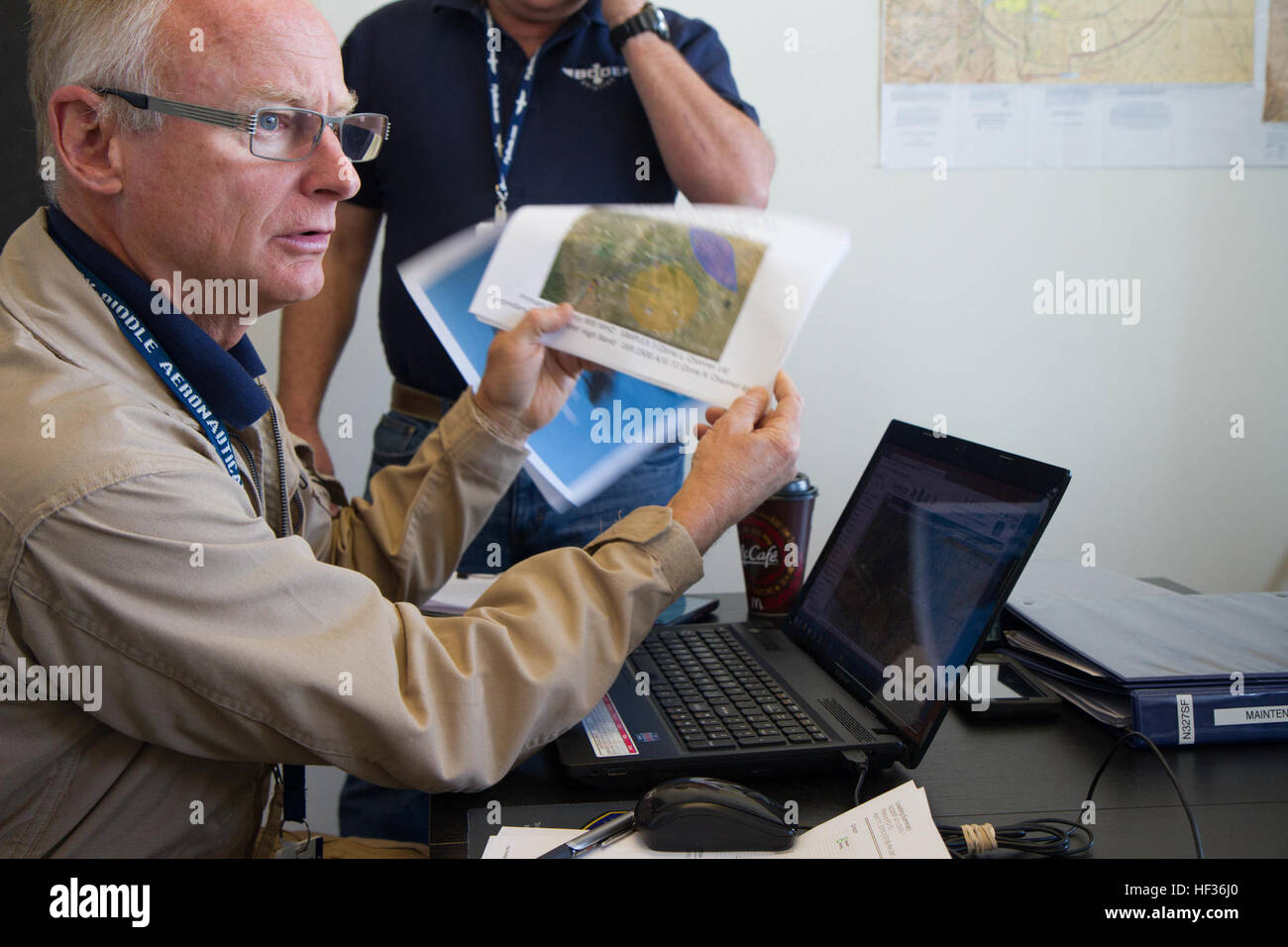 Tom Billson, the Chief Pilot for Bode Aviation, conducts a pre-flight ...