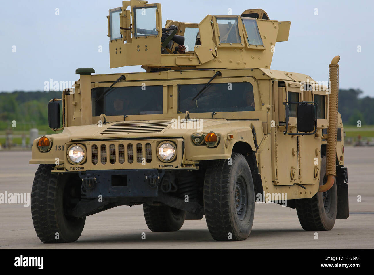 A High Mobility Multipurpose Wheeled Vehicle drives by the crowd during ...