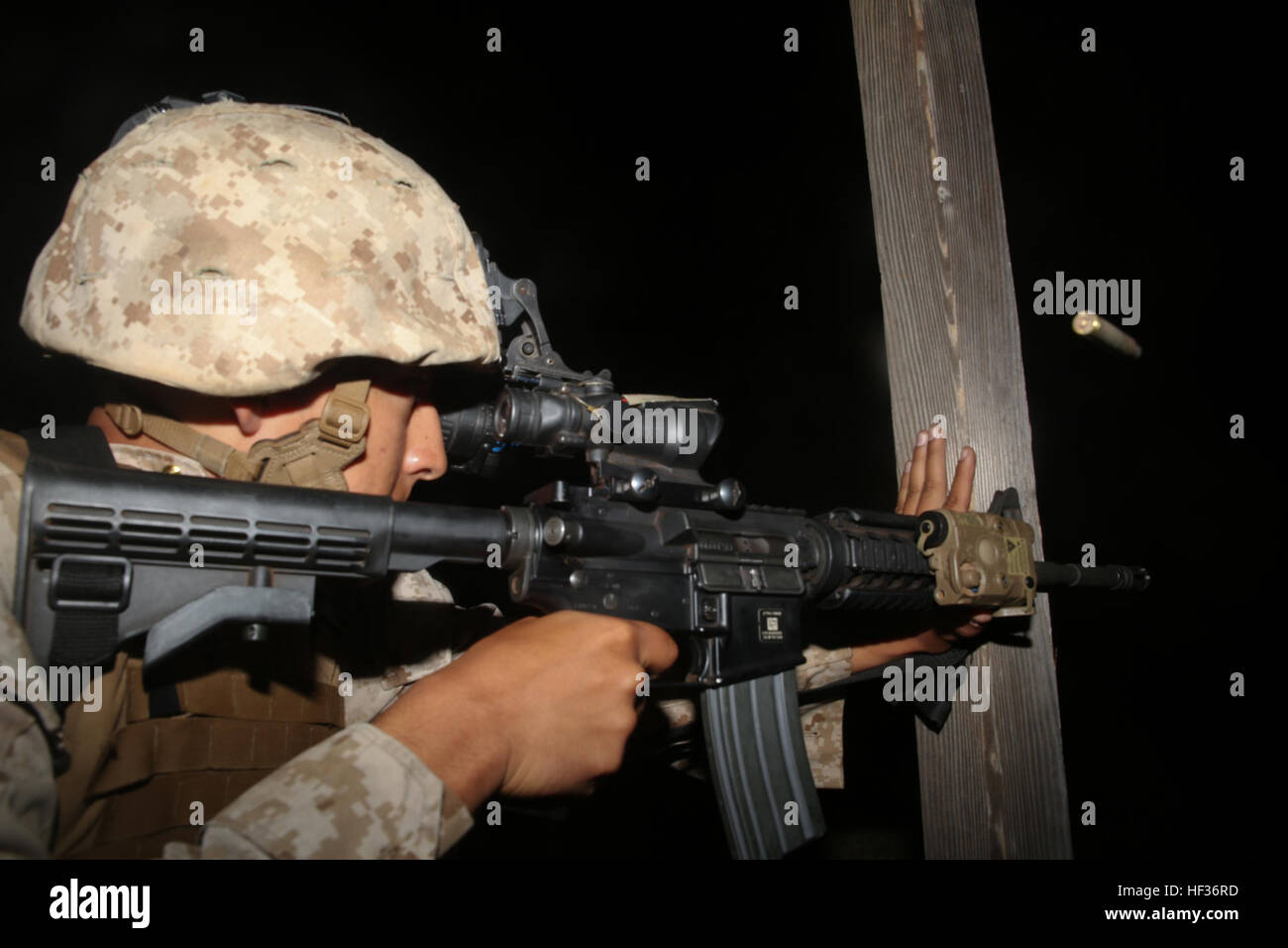 Marines with 3rd Radio Battalion fire M4 carbines during night ...