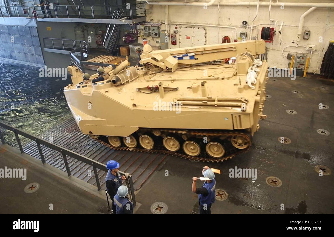 Navy sailors aboard USS Green Bay guide an Amphibious Assault Vehicle ...