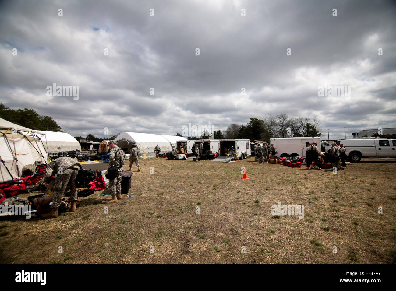 U.S. Army Soldiers from the National Guard set up tents during a full ...