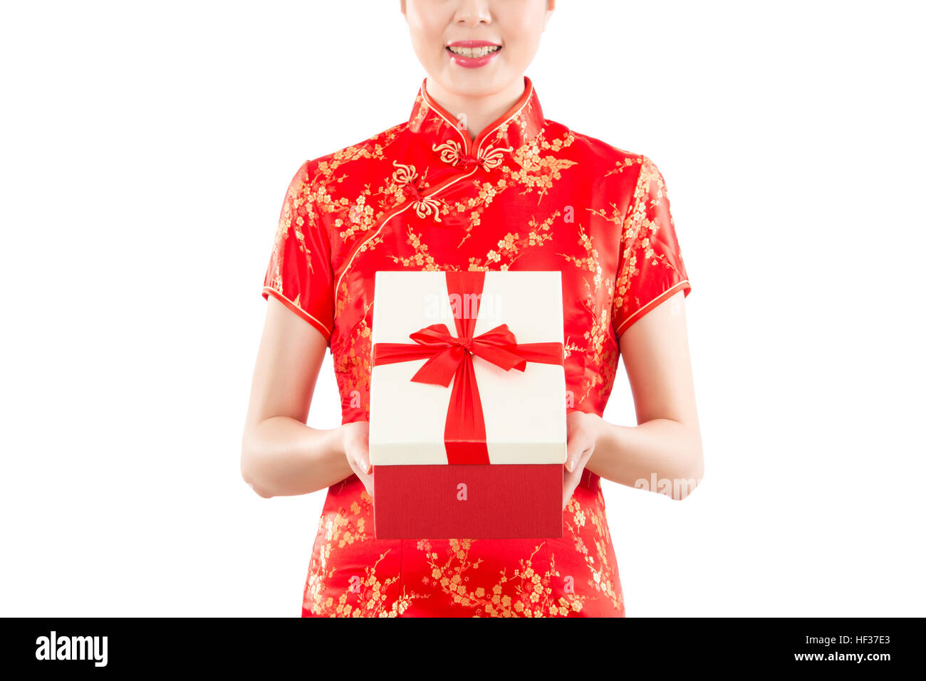 Gift woman in red giving chinese new year present smiling to camera ...
