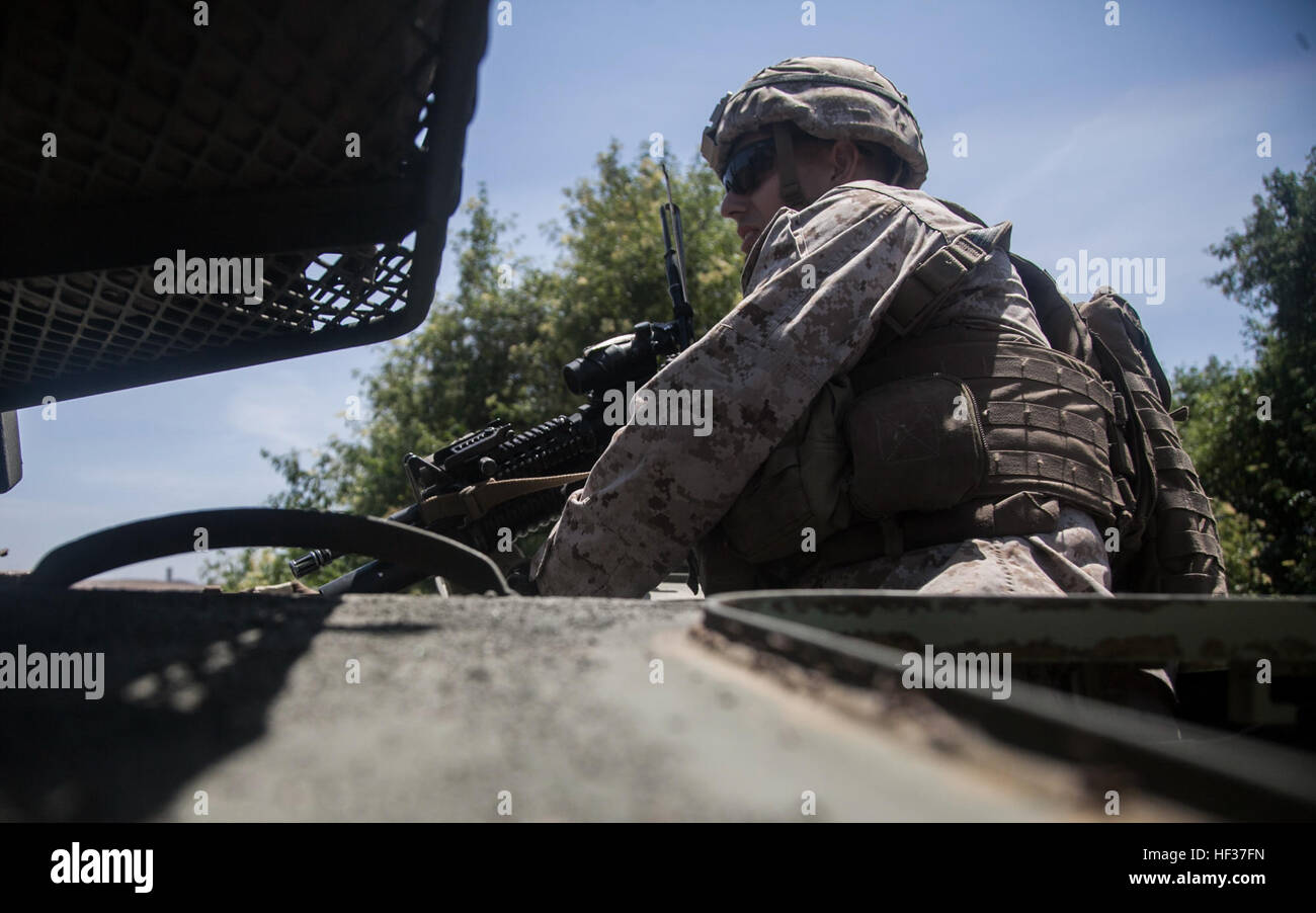 U.S. Marine Cpl. Andrew Kocan scouts the area from a Light Armored ...