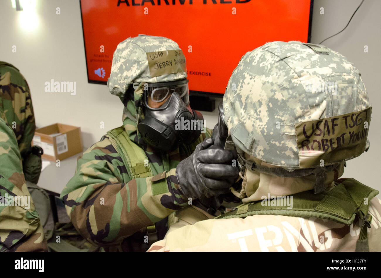Senior Airman Jerry Radcliffe helps Tech Sgt. Robert Young, both ...
