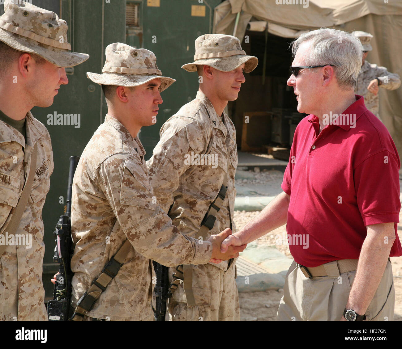The U.S. Secretary of the Navy the Honorable Ray Mabus shakes the hand ...