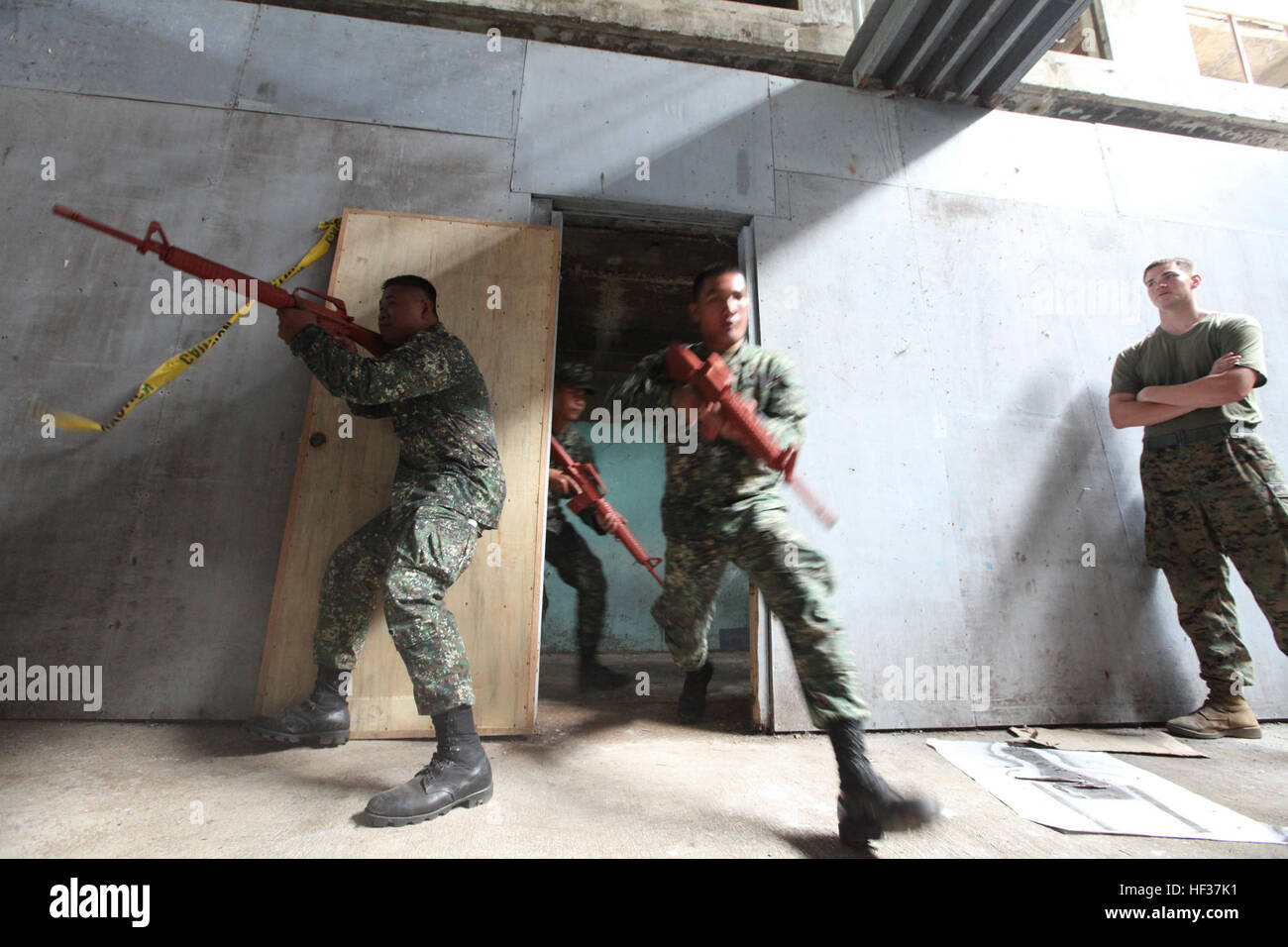 Philippine Marines clear a room during Balikatan 2011 as their ...