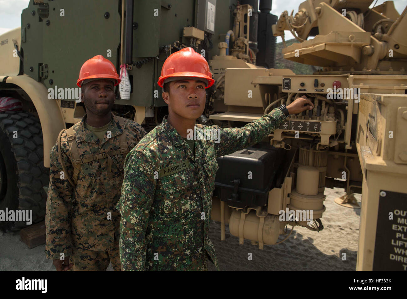 Philippine Marine Pvt. Arjel Fabrigas controls the crane on a MKR-15 ...