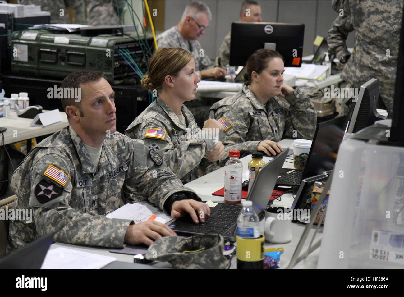 Soldiers with Task Force 38 monitor incoming communications during a ...
