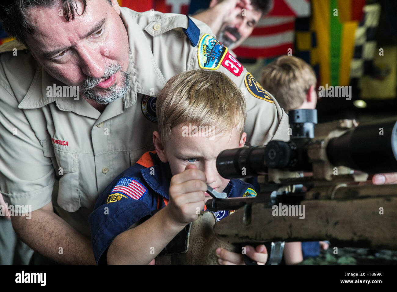A Cub Scout visiting the amphibious assault ship USS Wasp (LHD 1) with ...