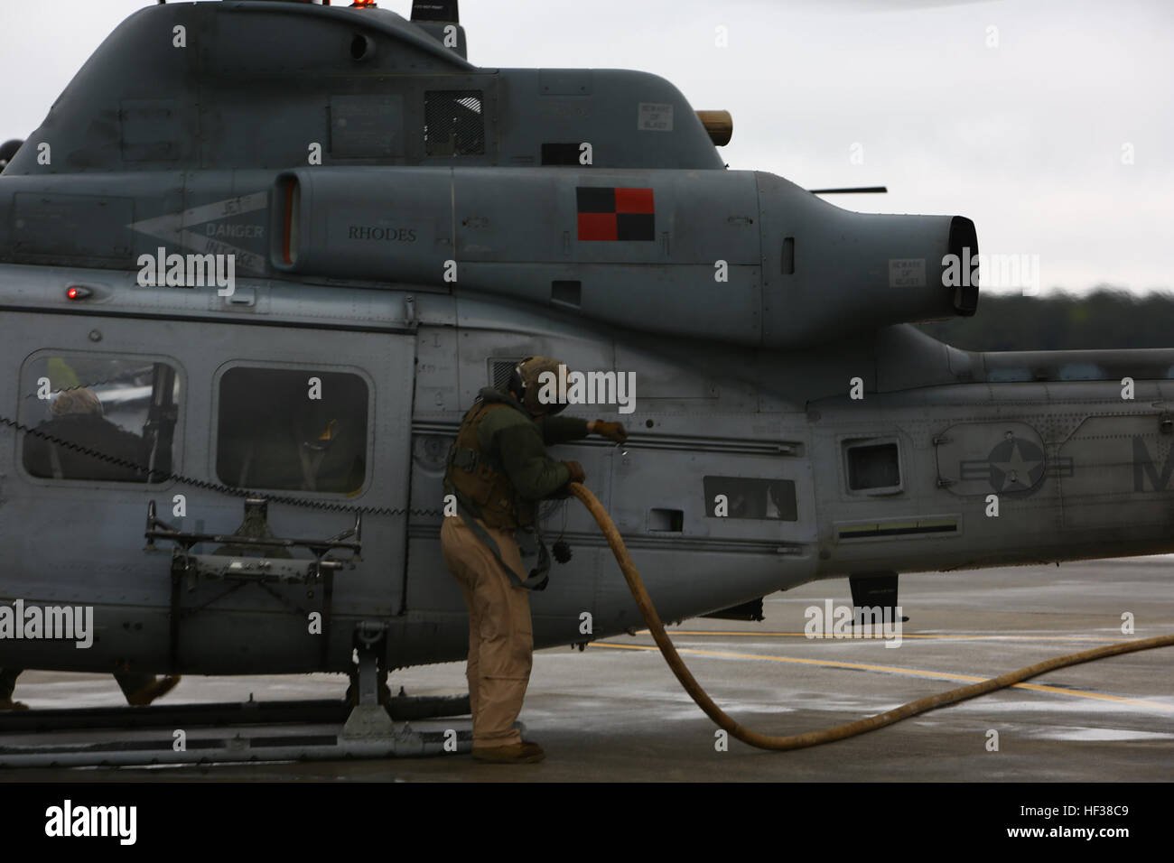 An UH-1Y Venom pilot with Marine Medium Tiltrotor Squadron (VMM) 162 ...