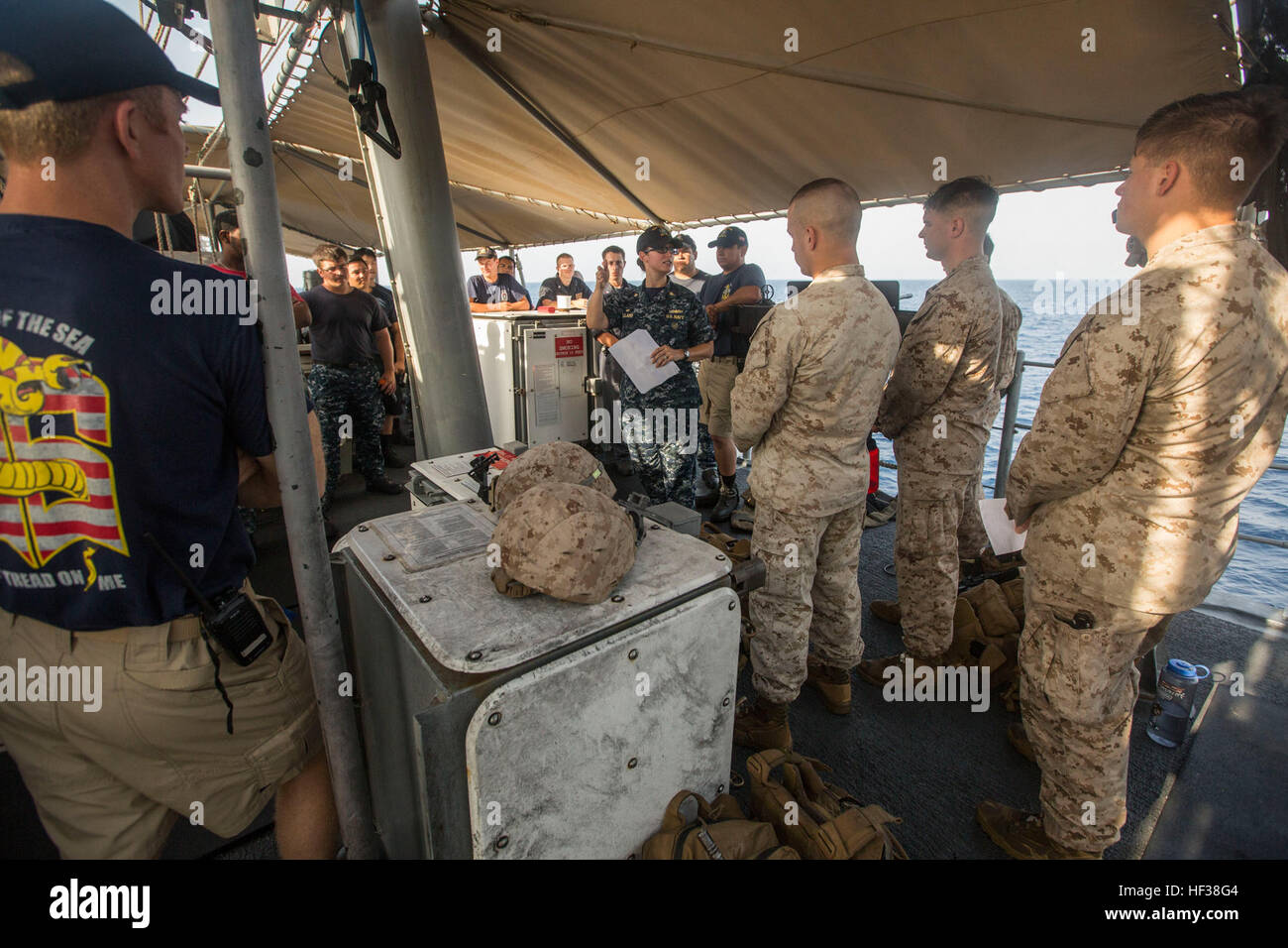 Lt. Cmdr. Janice Pollard, center, the commanding officer of mine ...