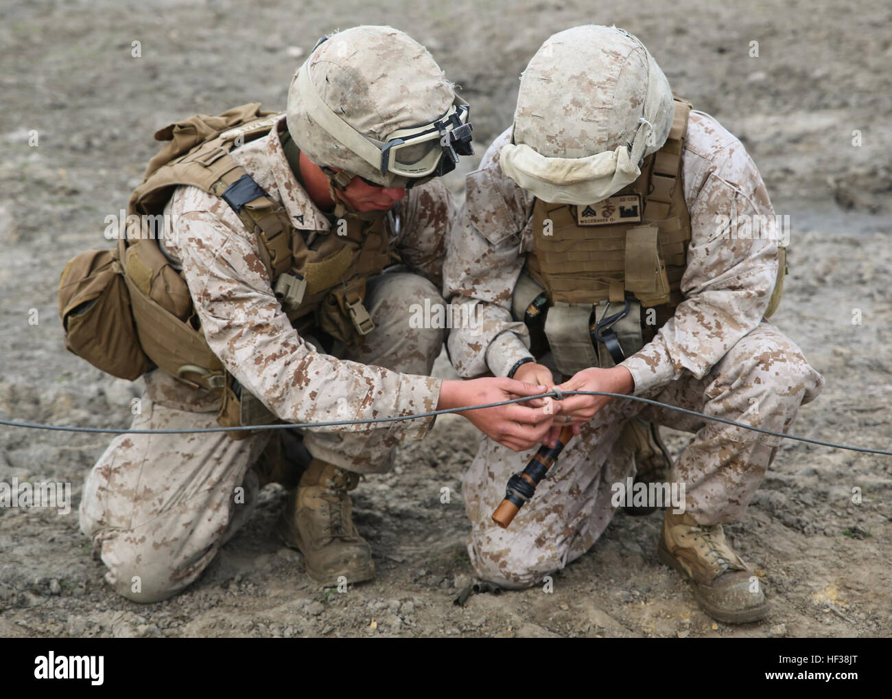 Marines with 2nd Combat Engineer Battalion set up an explosive charge ...