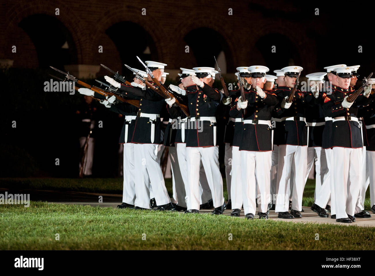 U.S. Marines with the Silent Drill Platoon perform during an evening ...