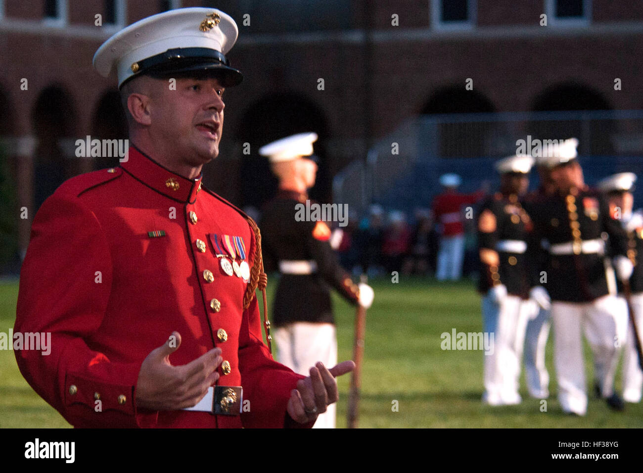A U.S. Marine with Marine Barracks Washington (MBW) speaks to ...