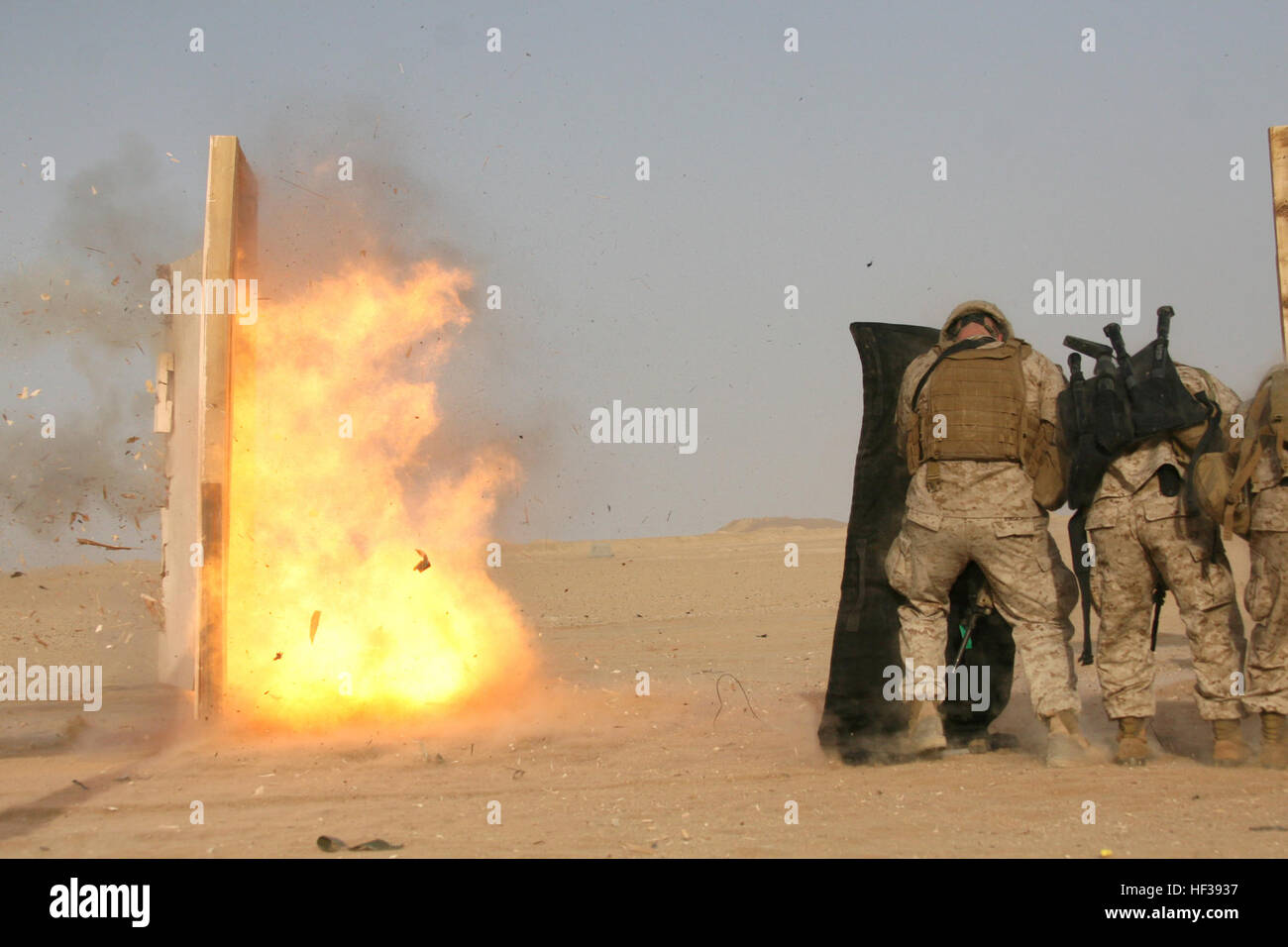 Flames engulf a makeshift door after Marine combat engineers with ...