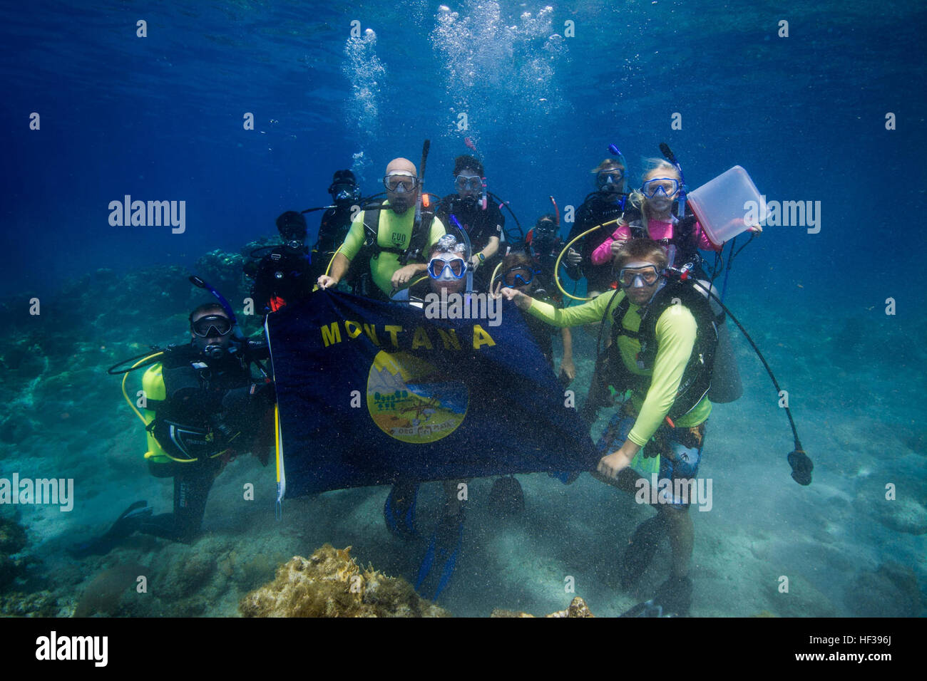 Residents from Montana hold their state flag while scuba diving in the ...