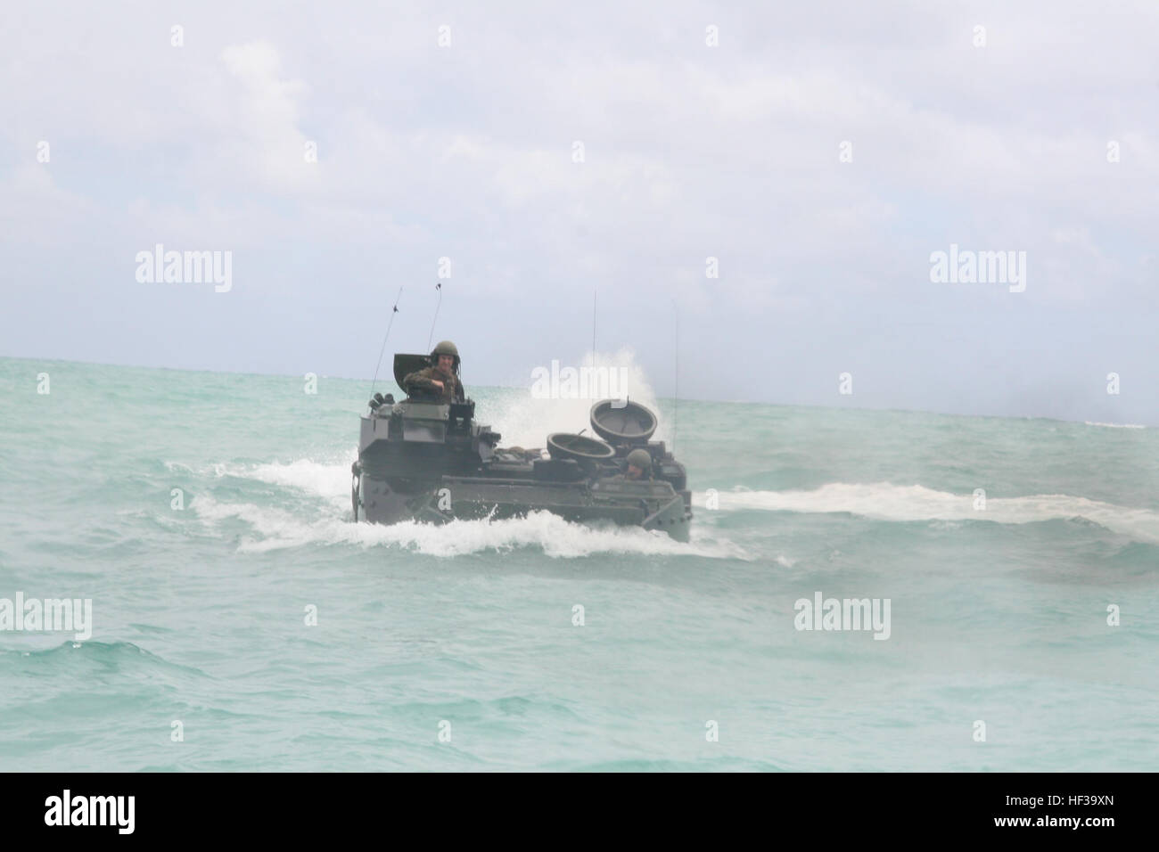 A U.S. Marine Corps amphibious assault vehicle (AAV) tears through the ...