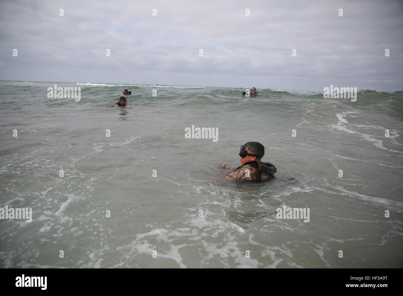 Marines with 1st Marines Special Operations Support Battalion don fins ...