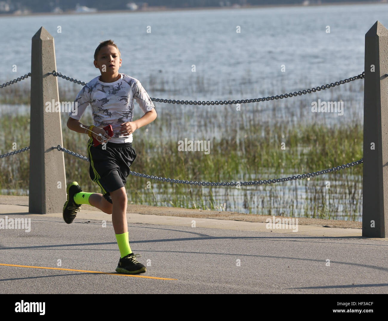 A young boy runs in the Centennial 5k Fun Run, aboard Marine Corps ...