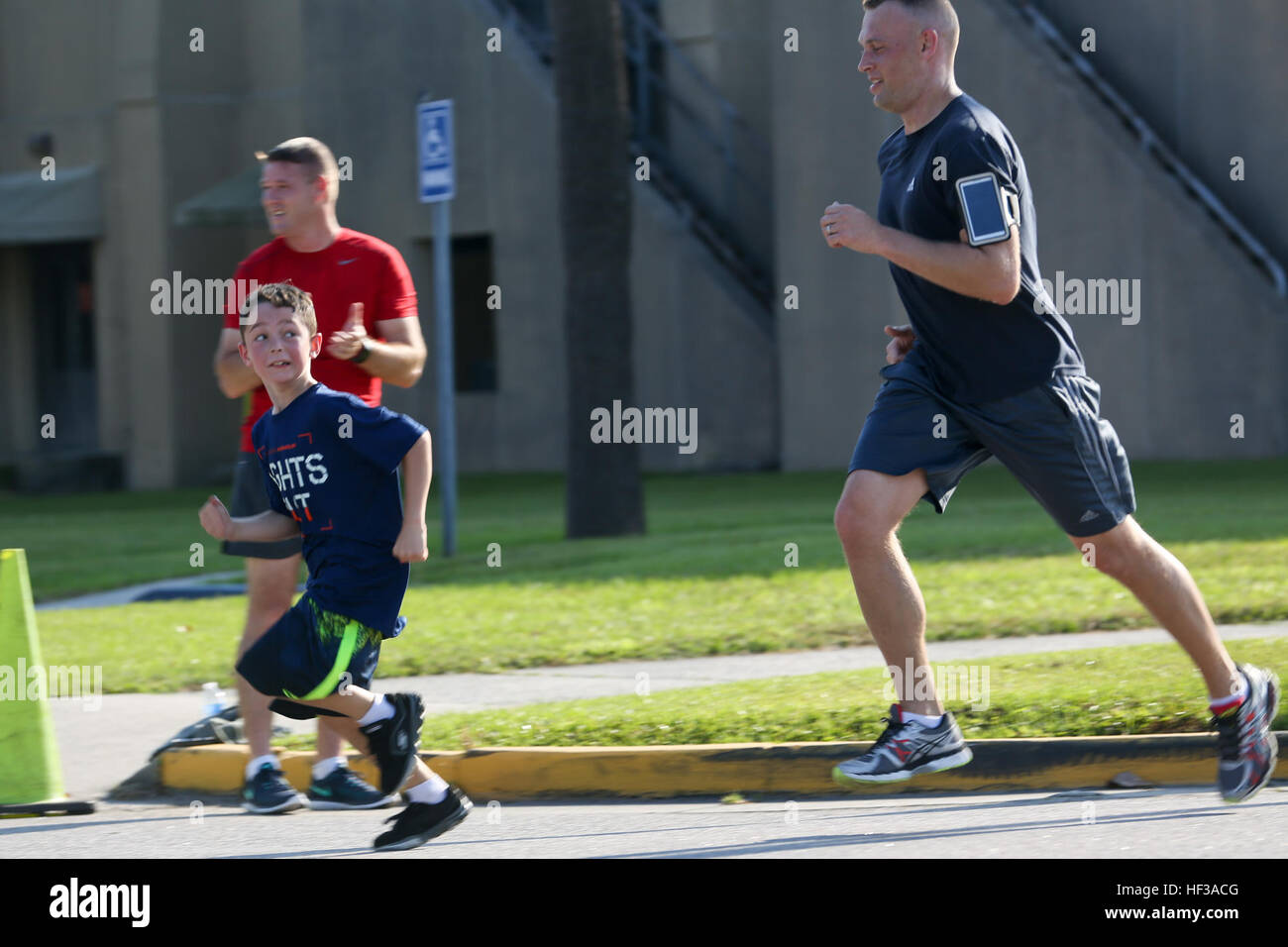 A young boy runs in the Centennial 5k Fun Run, aboard Marine Corps ...