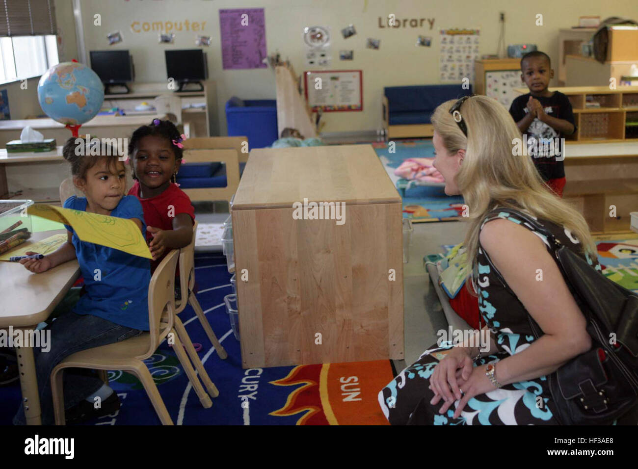 Lynne Mabus, right, wife of Secretary of the Navy Ray Mabus, talks to ...